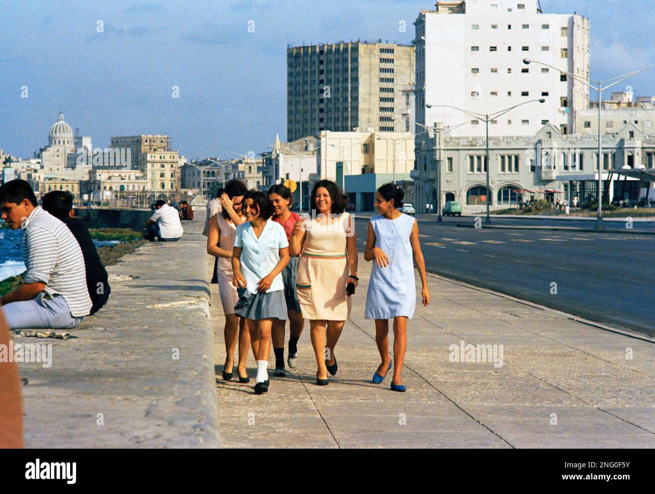 Pictured here is a group of young women walking on the Malecon in ...