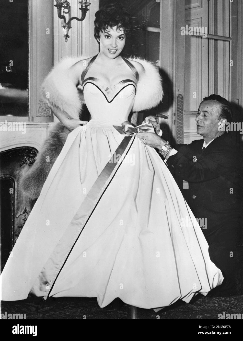 Italian actress Gina Lollobrigida presents a creation by Italian ...