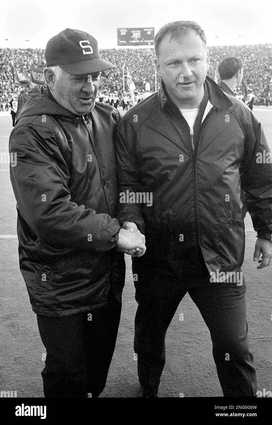 Michigan coach Bo Schembechler, right, has little to smile about as he ...