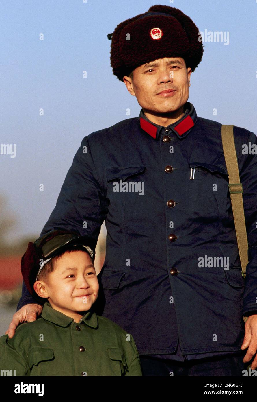 Pictured here is a Red Guard with a young boy at the Forbidden City in ...