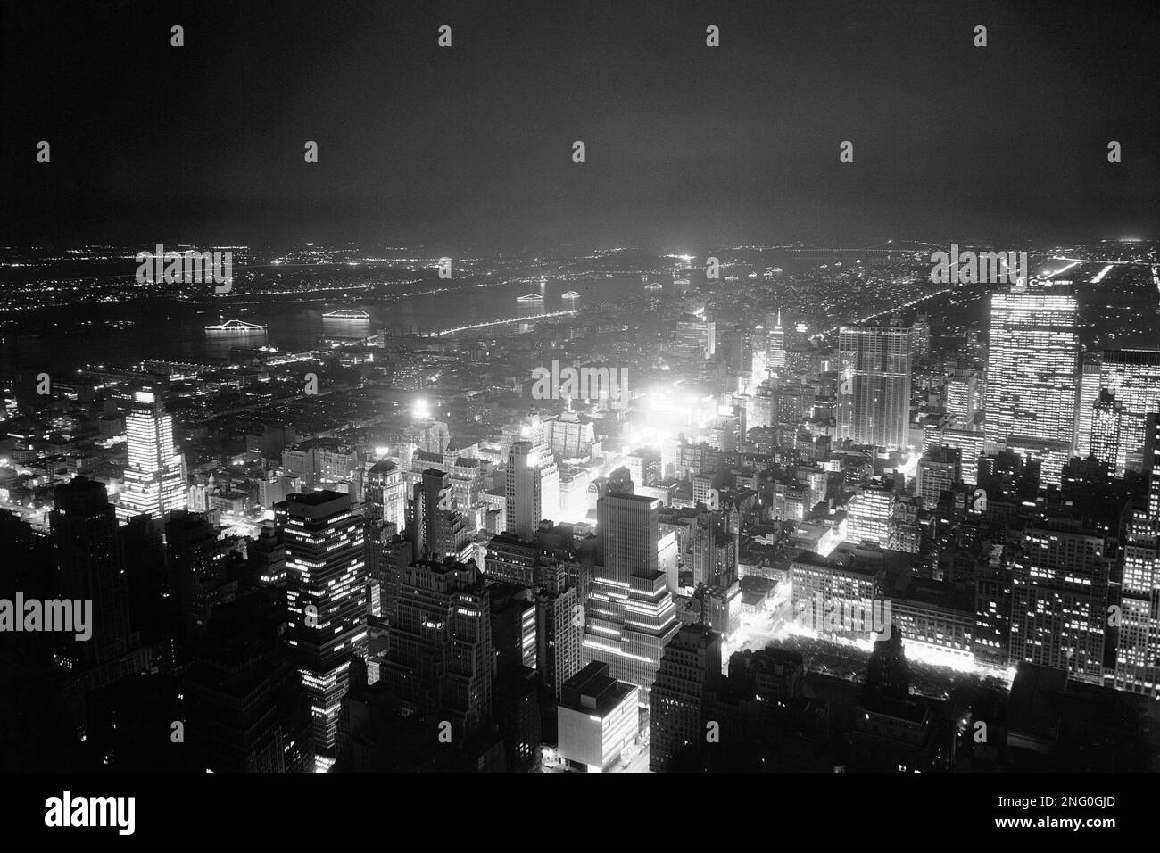 Brightly lit buildings in the Manhattan borough of New York, beam a ...