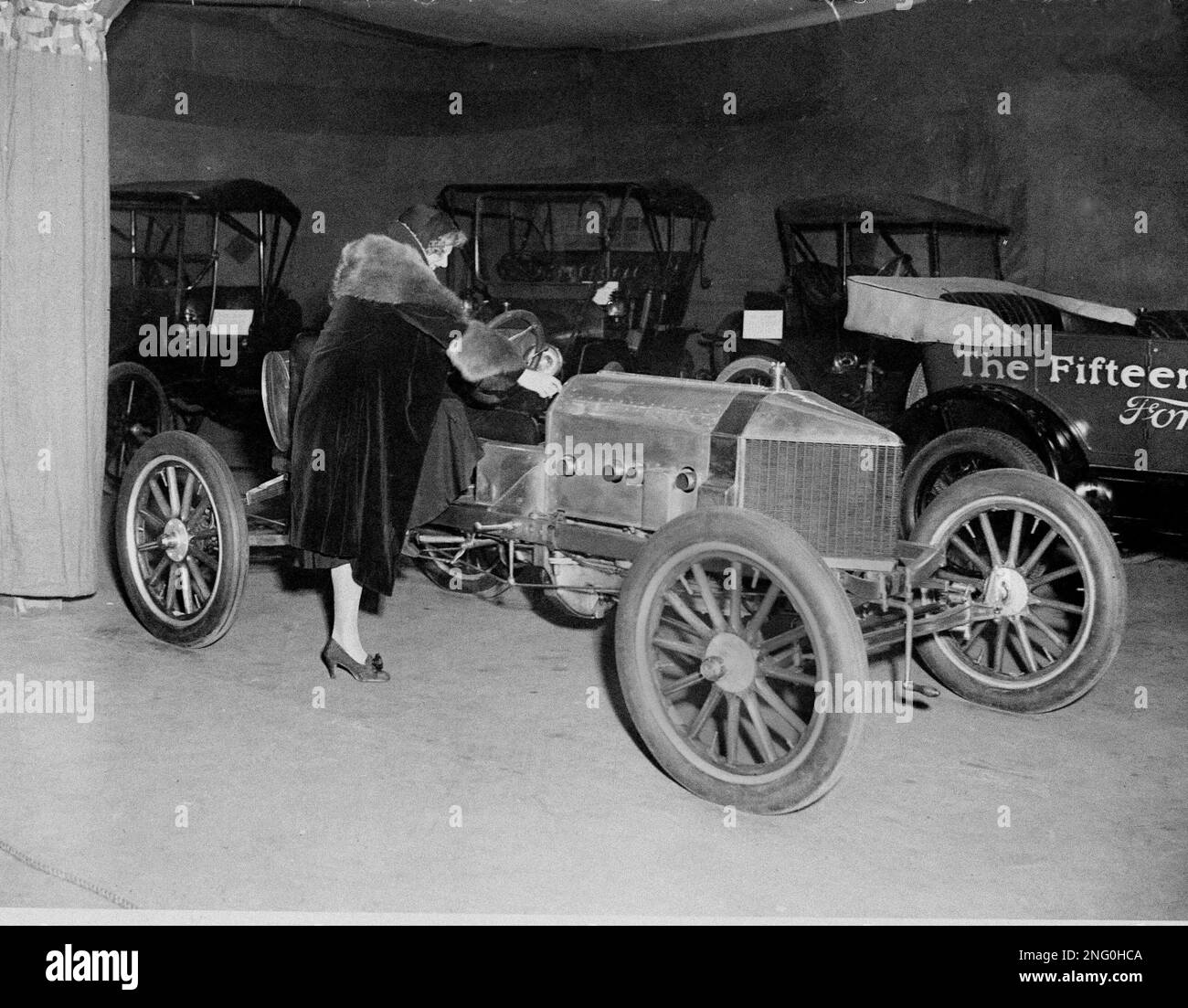 Charlotte Mosier looks over the Ford Racer, January 18, 1932 which was ...