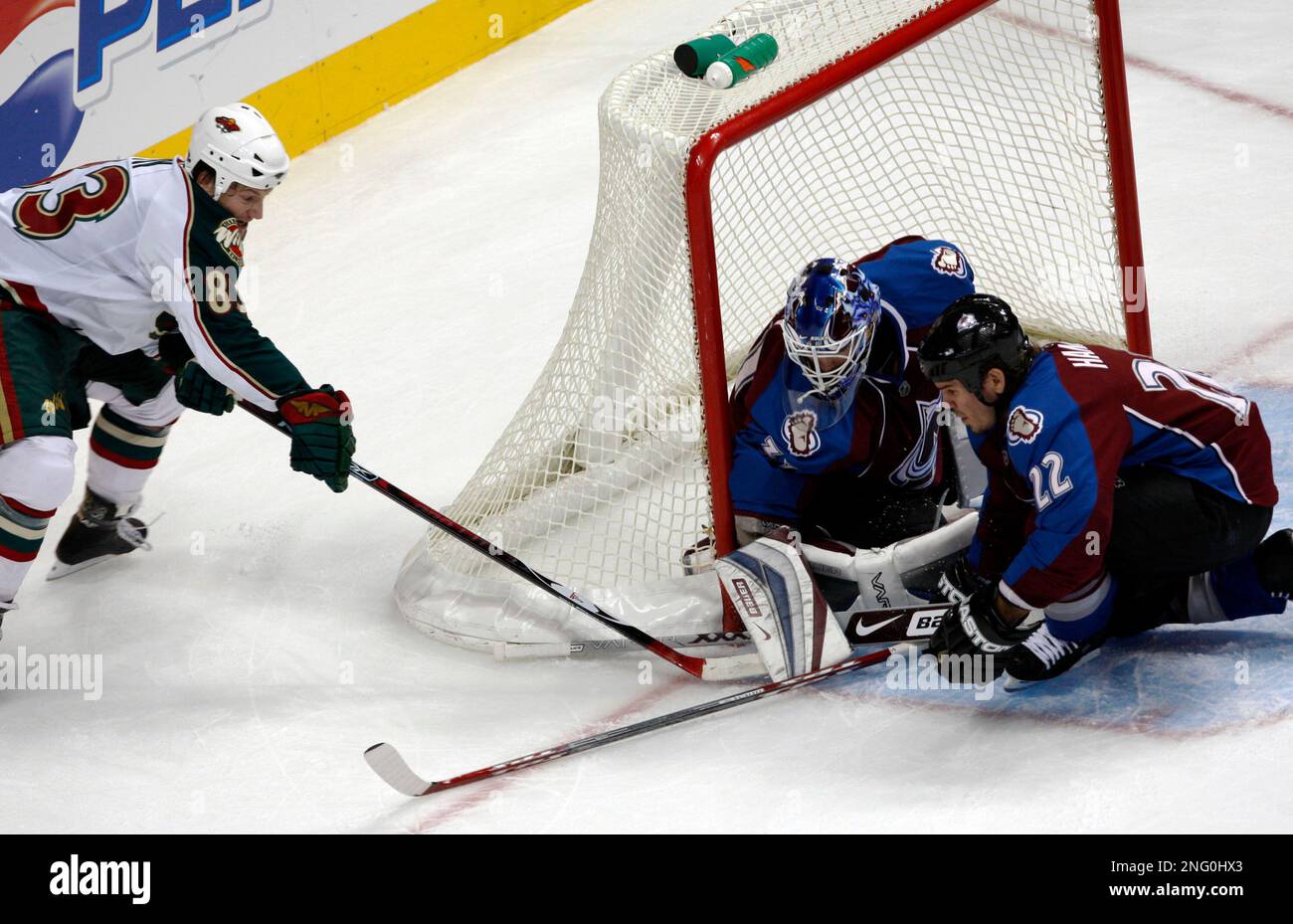 Minnesota Wild right winger Matt Foy, left, has his shot blocked by ...