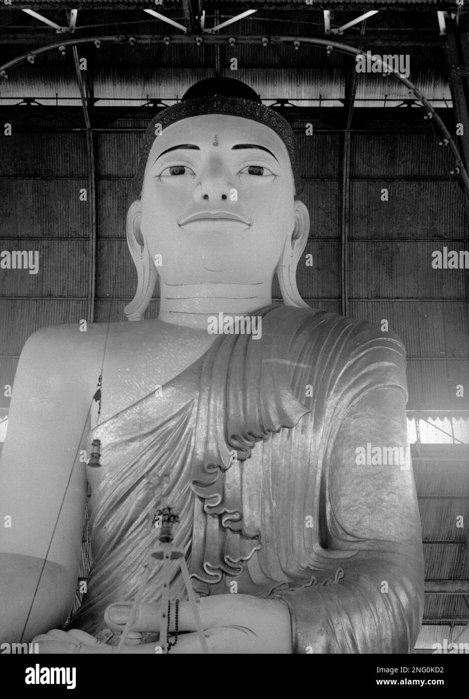 A giant Buddha statue is seen under a modern steel shed near Rangoon ...