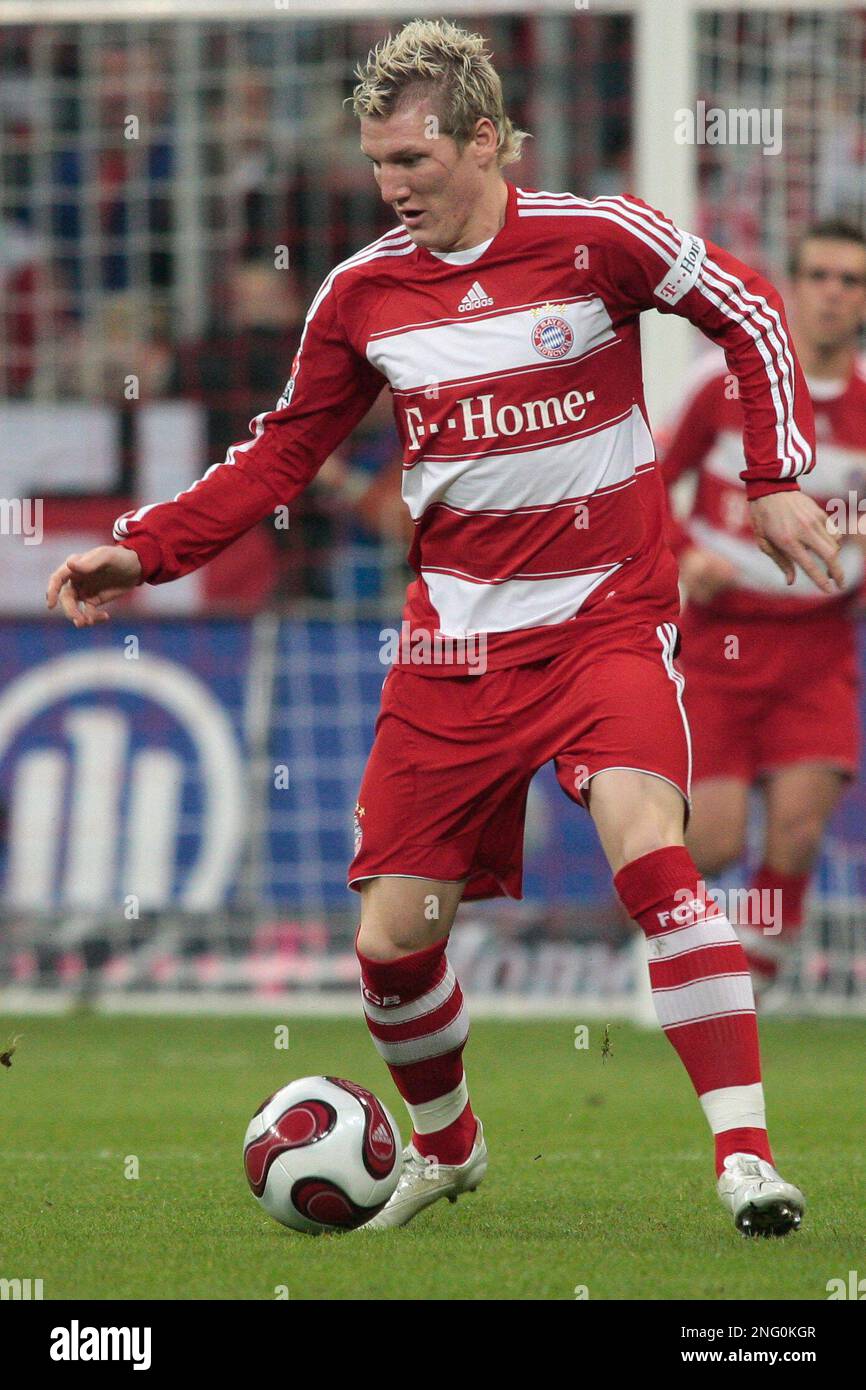 Munich's Bastian Schweinsteiger goes for the ball during the German ...