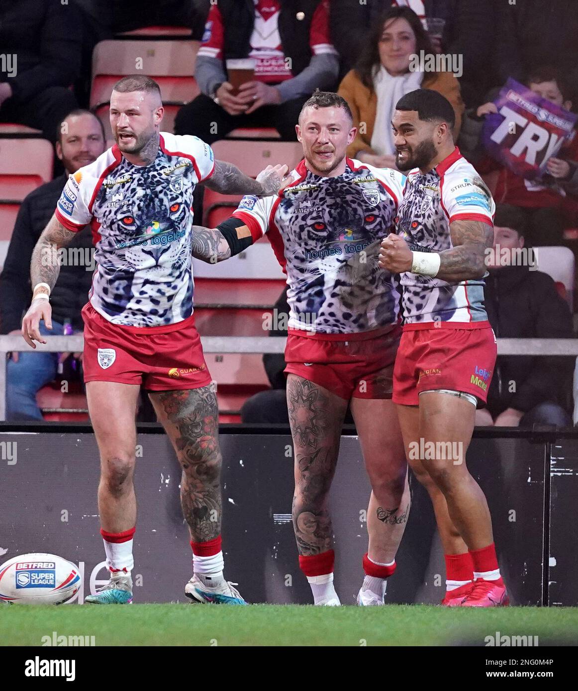 Leigh Leopards' Josh Charnley (centre) celebrates scoring a try during ...