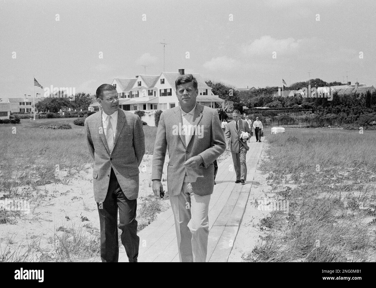 President John Kennedy, right, walks with Secretary of Defense Robert ...