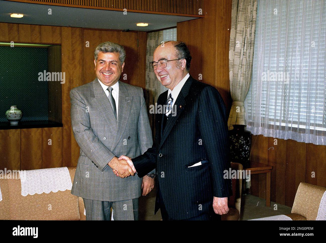 Iraqi oil minister Issam Abdul Raheem Al-Chalabi, left, shakes hands ...
