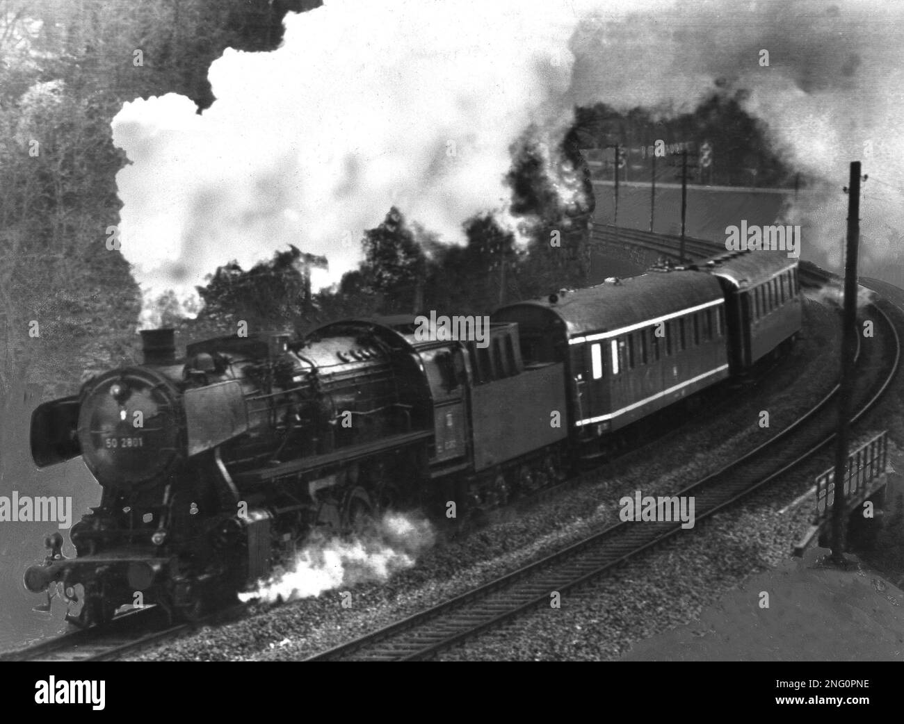 A passenger train pulled by a steam locomotive of the Deutschen ...