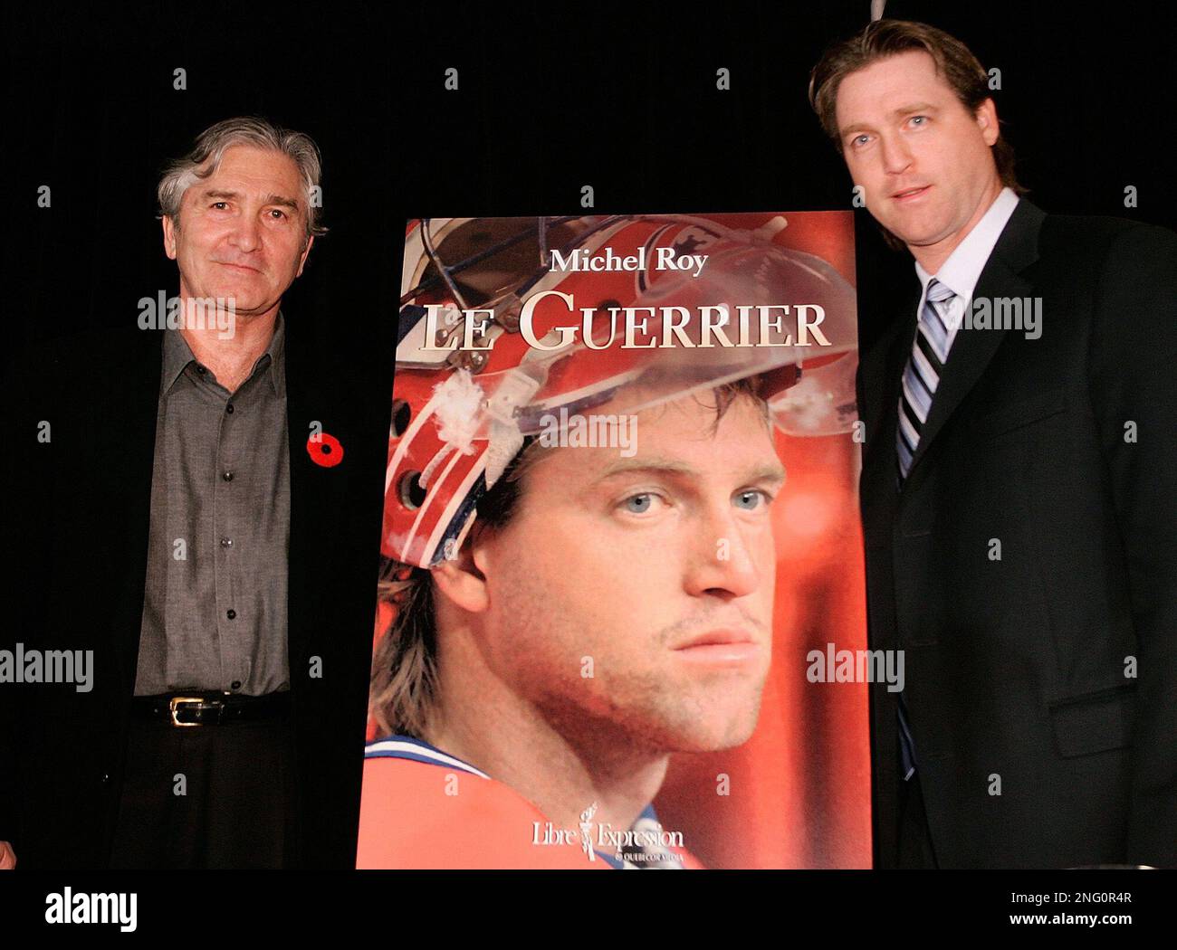 Former NHL goalie Patrick Roy poses with his father Michel Roy, left ...
