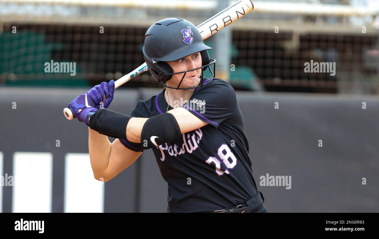 Furman catcher Riley Ludlam (28) bats during an NCAA softball game ...