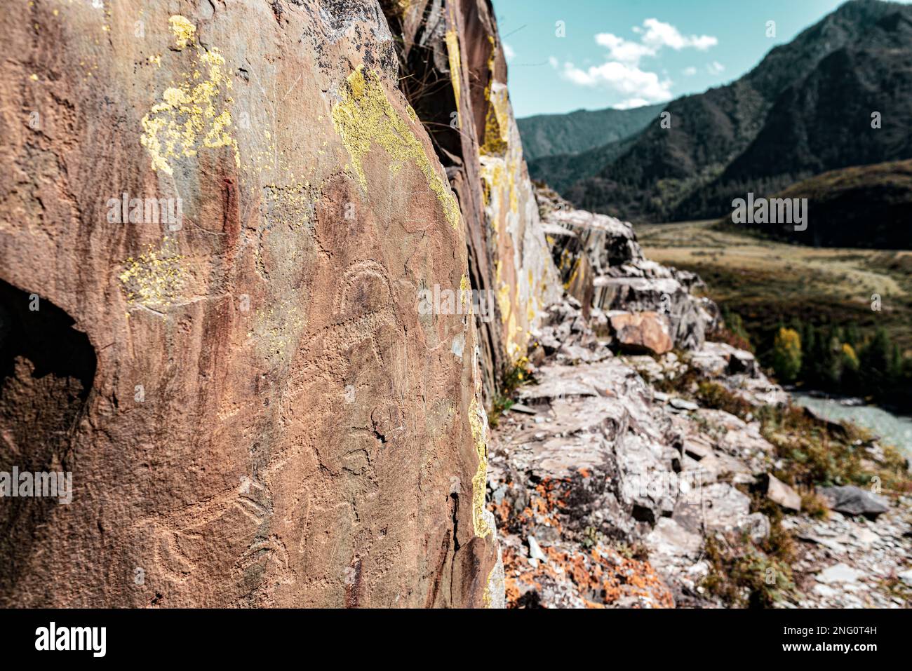 Petroglyphs rock drawings of ancient people animals on the stones ...