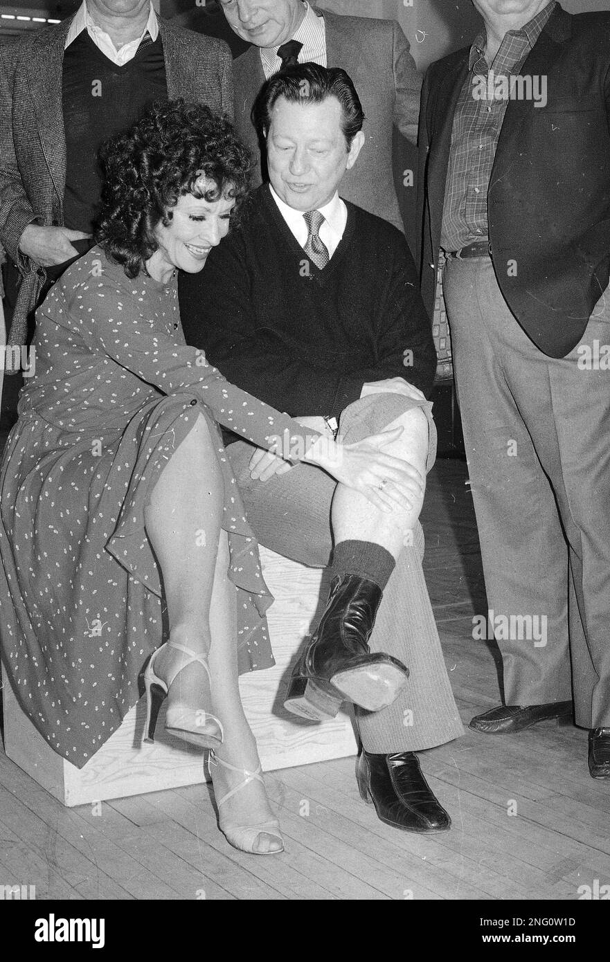 Actress Chita Rivera checks out Donald O'Connor's leg during a break ...