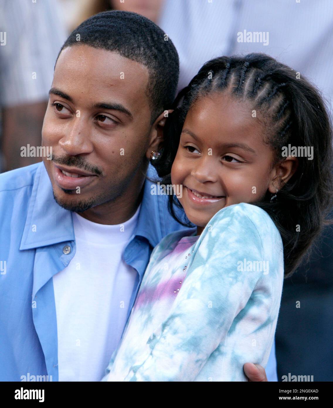 Ludacris, left, and his daughter, Karma Bridges, arrive at the premiere ...