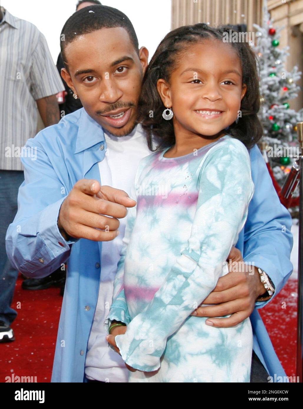 Ludacris, left, and his daughter, Karma Bridges, arrive at the premiere ...