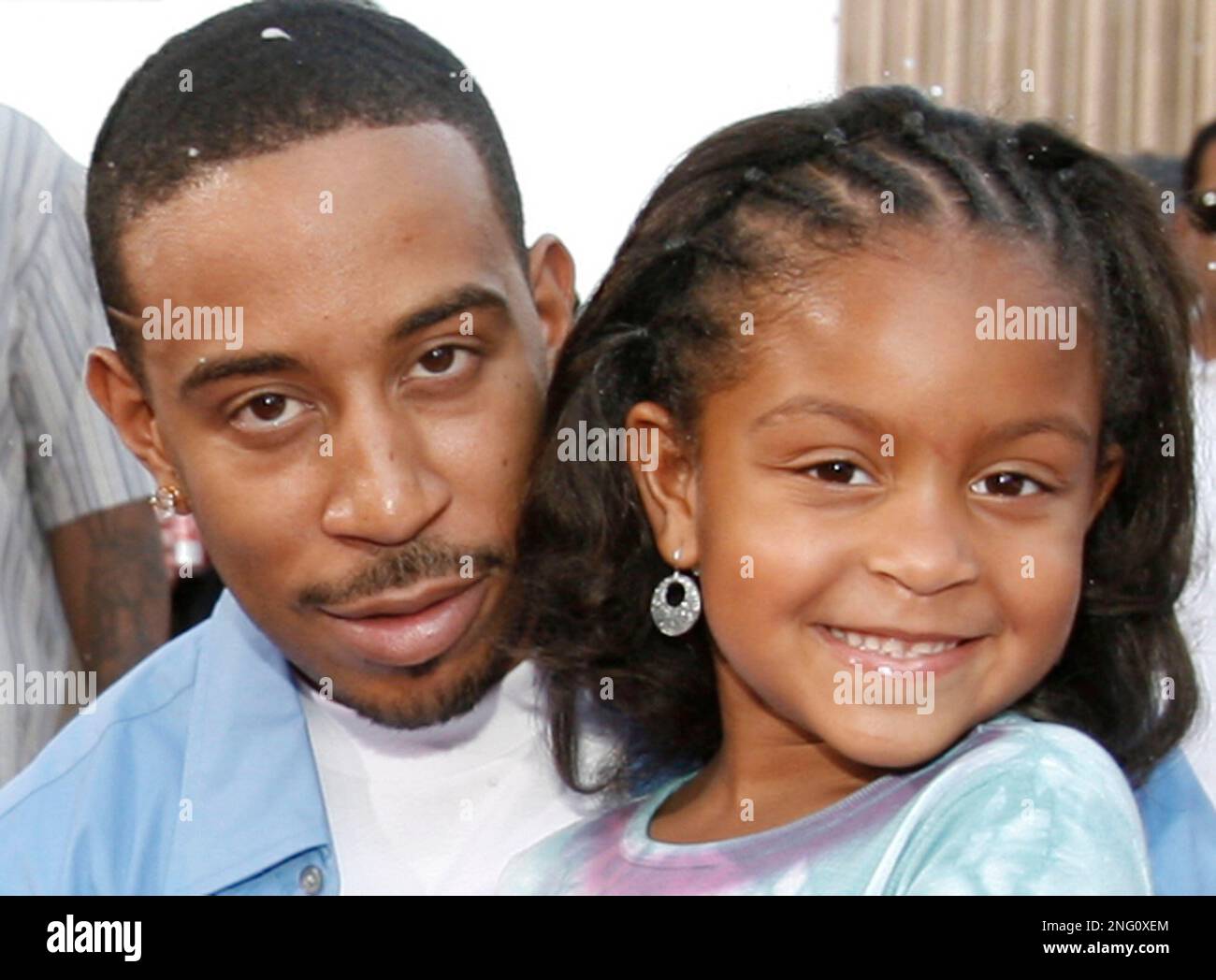 Ludacris, left, and his daughter, Karma Bridges, arrive at the premiere ...