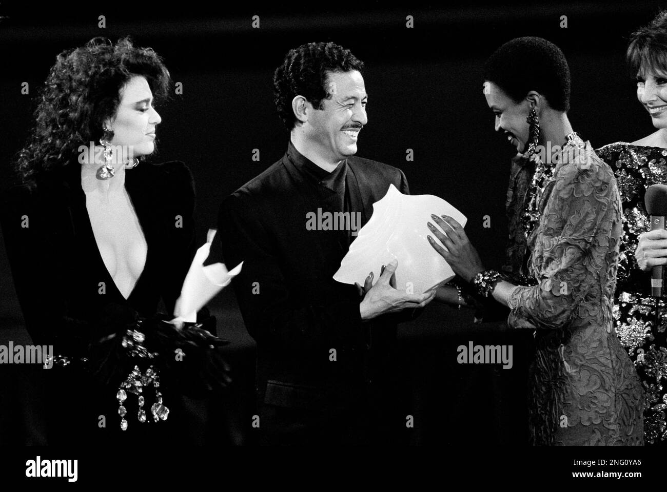 Japanese designer Isseye Miyake receives the award for showing best ...