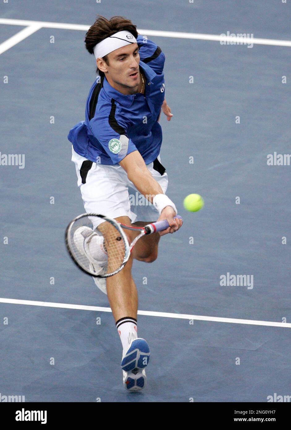 Spain's Tommy Robredo plays a return to Marcos Baghdatis of Cyprus ...