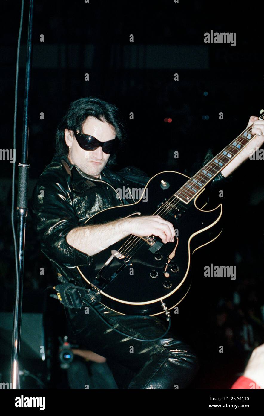 Lead Singer Bono of the Irish rock group U2 plays to a sold out crowd ...