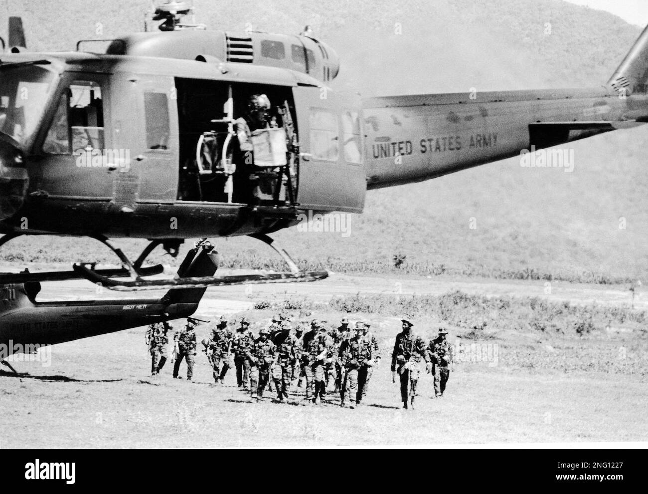 A Huey helicopter waits to airlift students of the U.S. Army's 5th ...