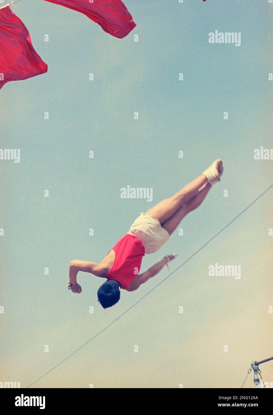 Acrobat performs during entertainment in the park behind Tien An Mien ...