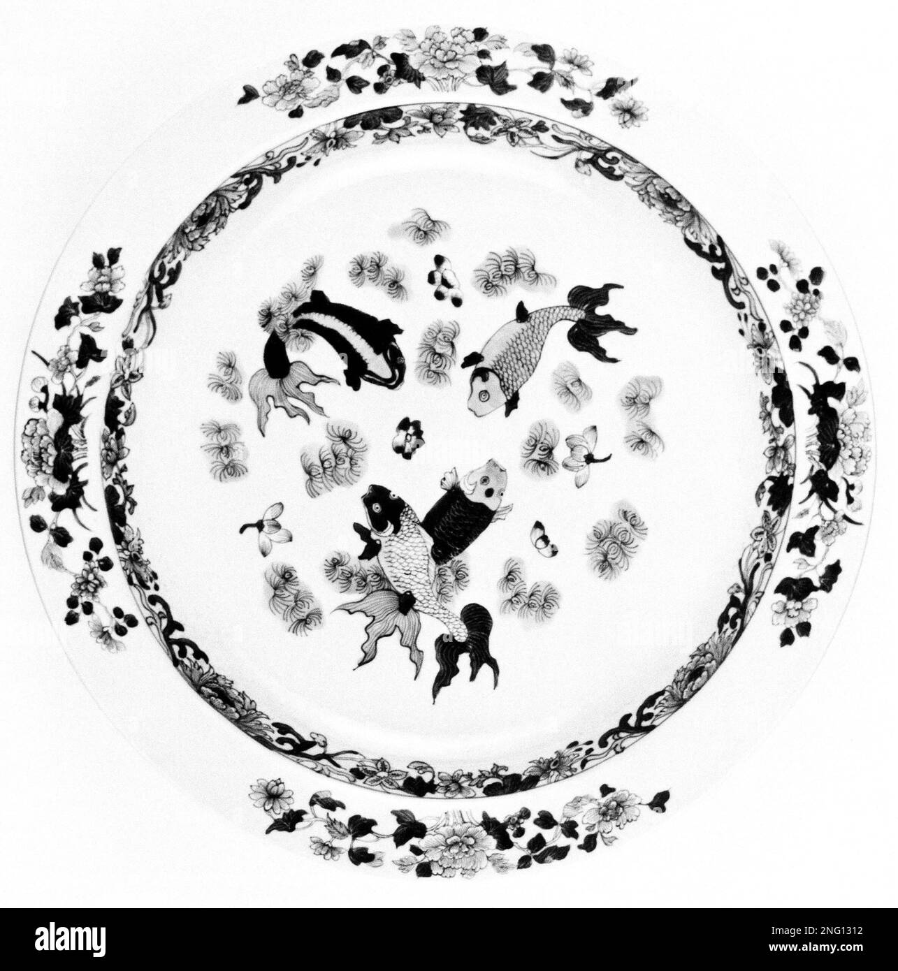 A large blue and white deep dish painted with four exotic fan tailed ...