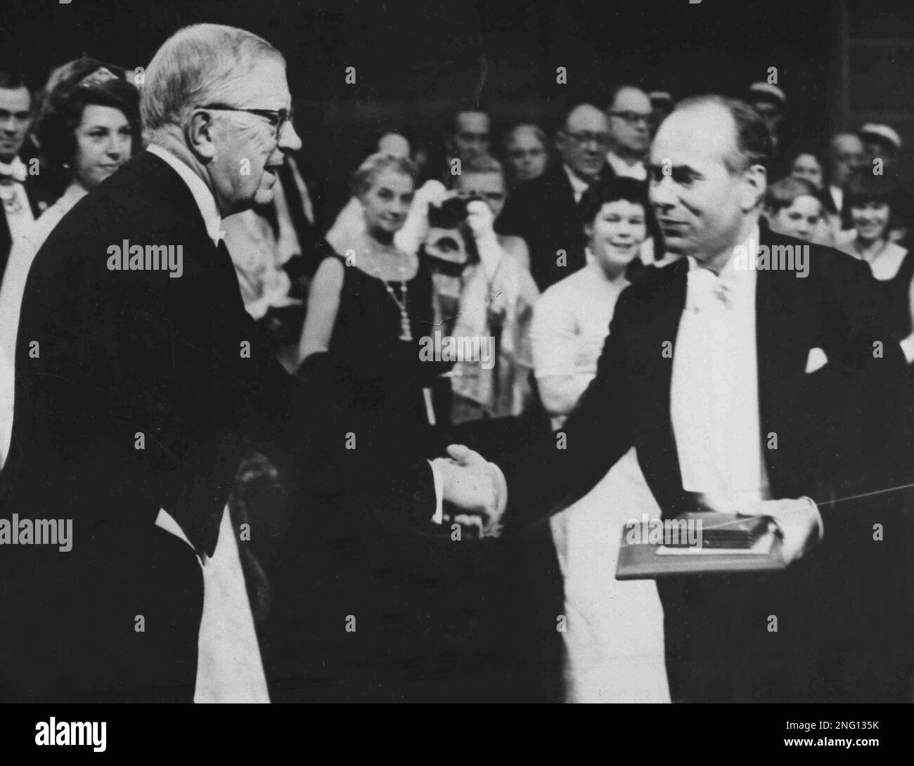 King Gustav VI Adolf of Sweden, left, presents Andrew Fielding Huxley ...