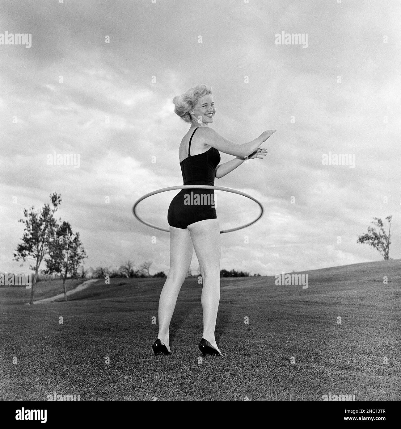 Model Fay Shott spins one of the new plastic Hula Hoops around her ...