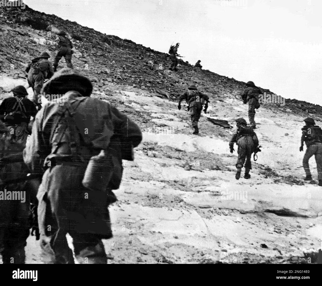 Israeli troops advance over broken ground in the deserts of the Sinai ...