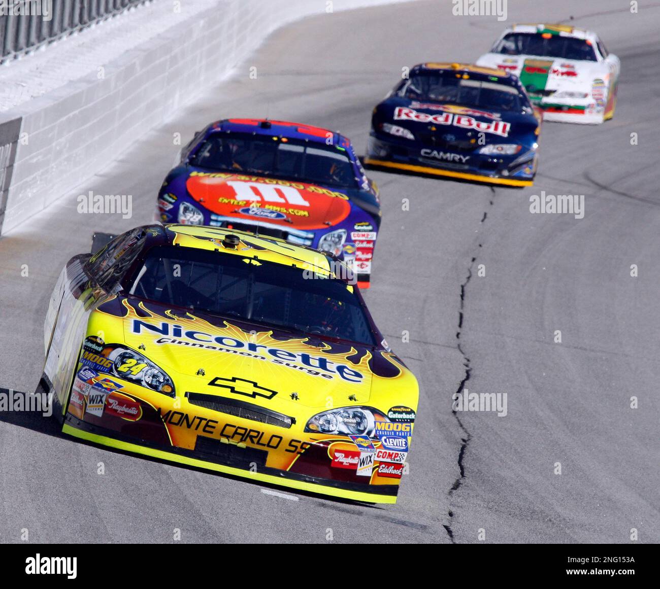 NASCAR driver Jeff Gordon is followed by David Gilliland, A.J ...