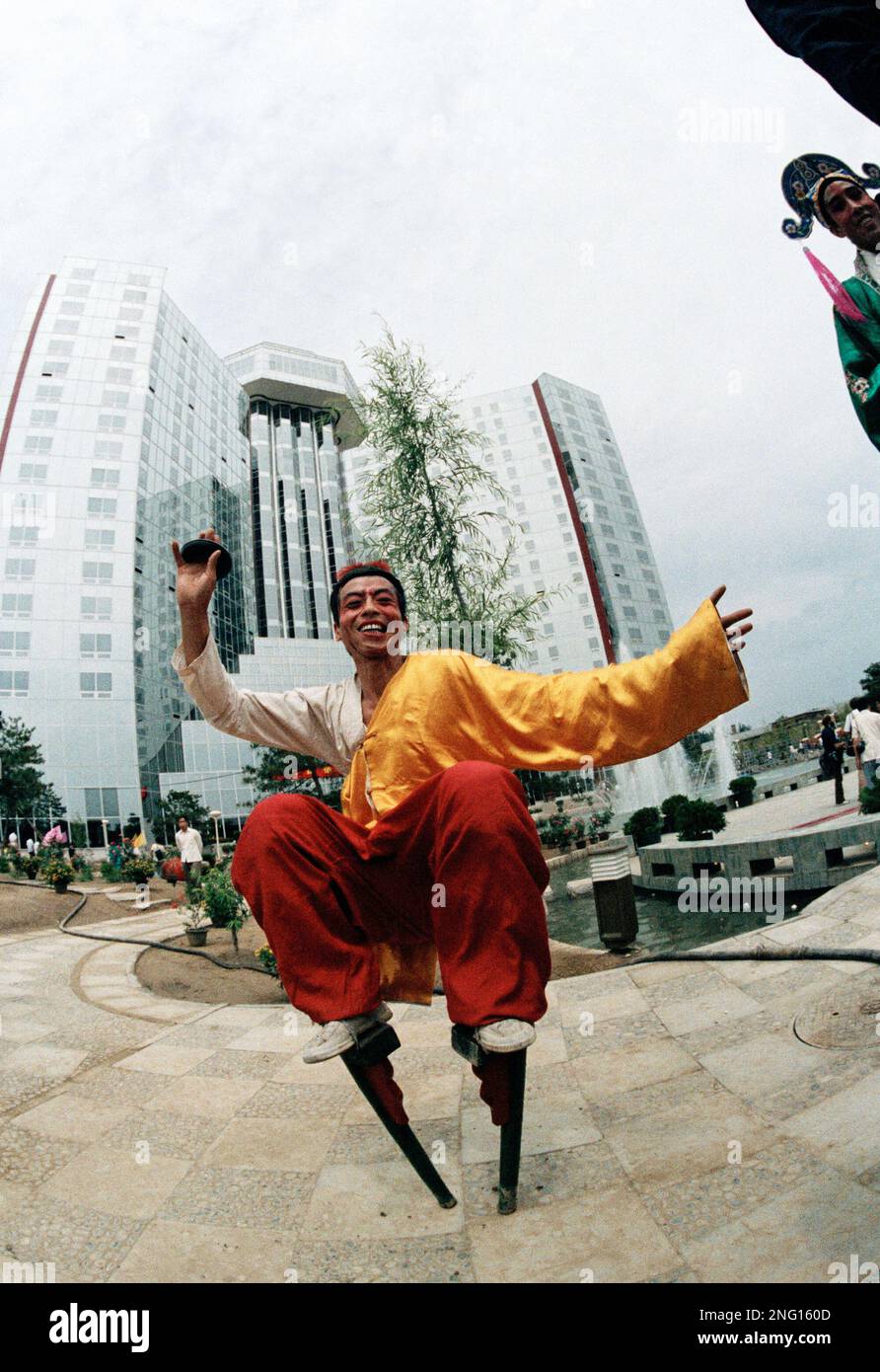 Chinese Acrobat performs stunts on stilts Wednesday, June 20, 1984 at ...