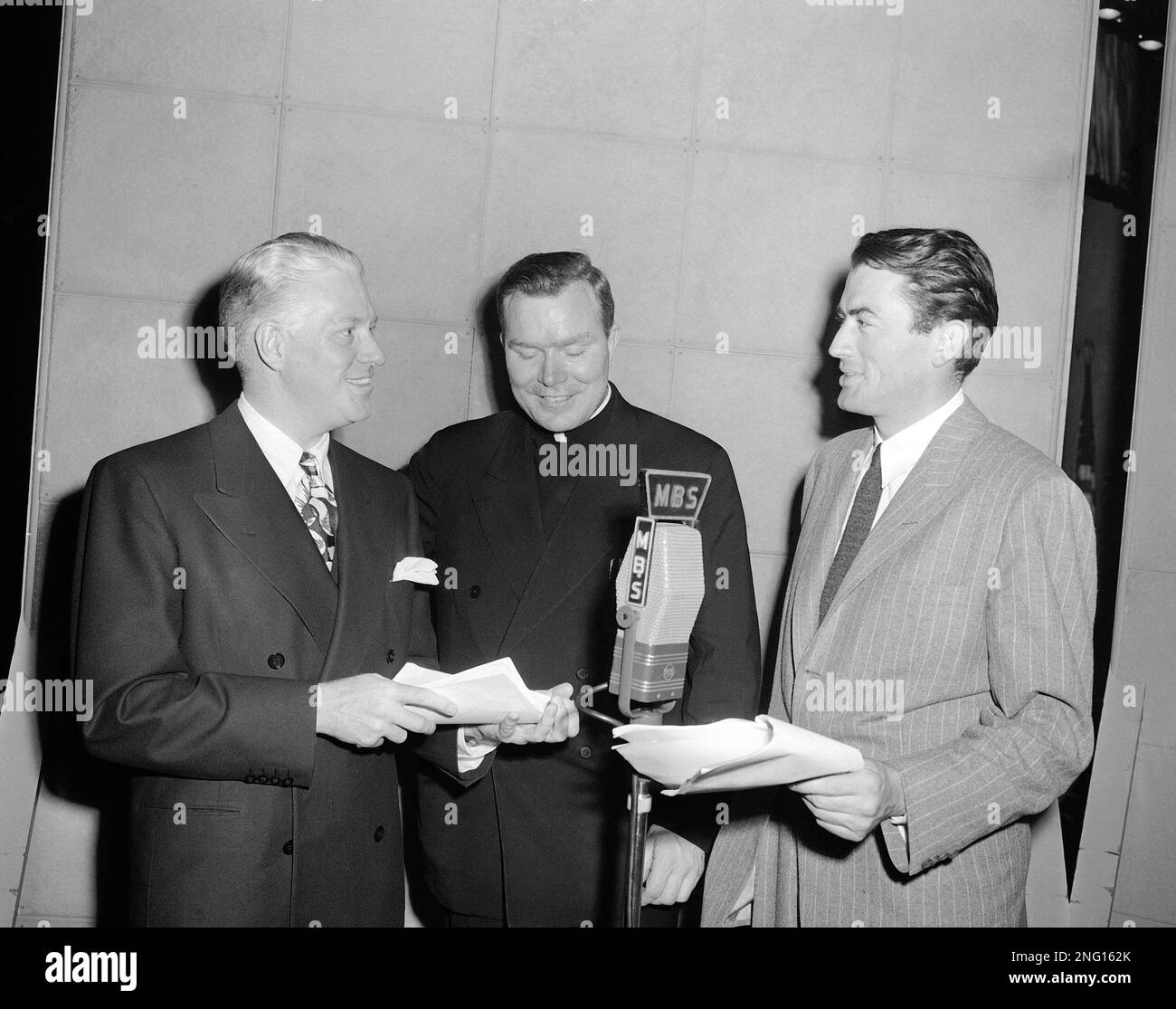 Nelson Eddy, Father Patrick Peyton and Gregory Peck attend a broadcast ...