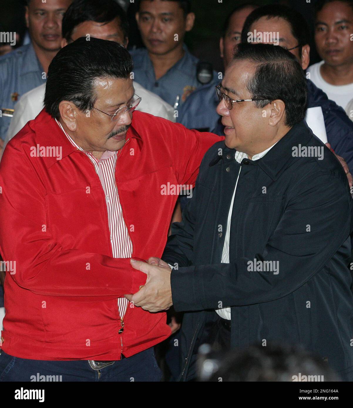 Ousted Philippine President Joseph Estrada, left, shakes hands with ...
