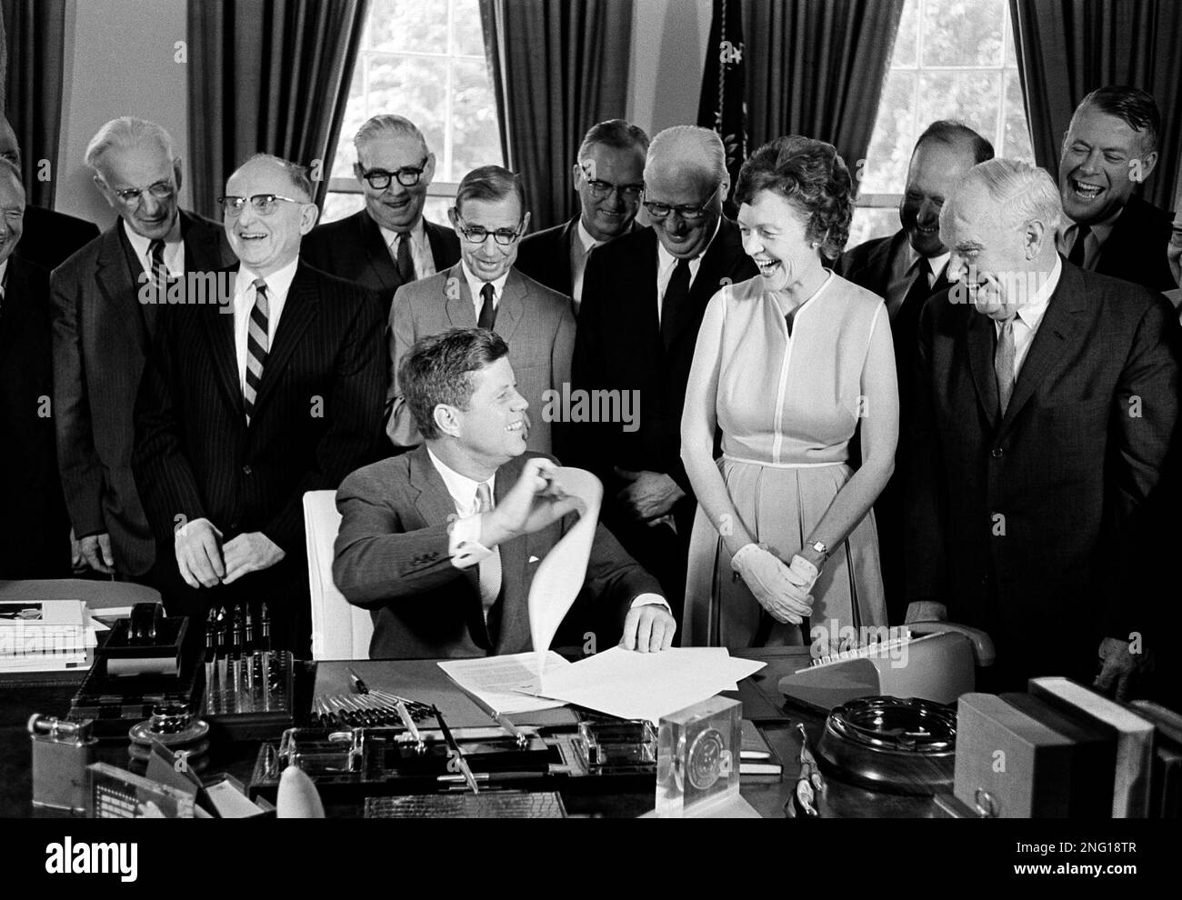 President John Kennedy flips the last page of the interstate highway ...