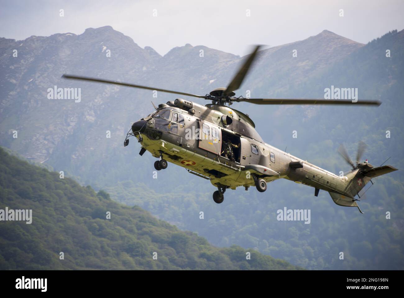 Swiss Air Force Helicopter Against Mountain in Switzerland Stock Photo ...