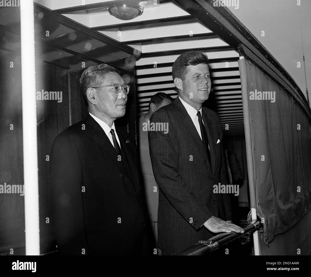 Japanese Prime Minister Hayato Ikeda and President John Kennedy stand ...