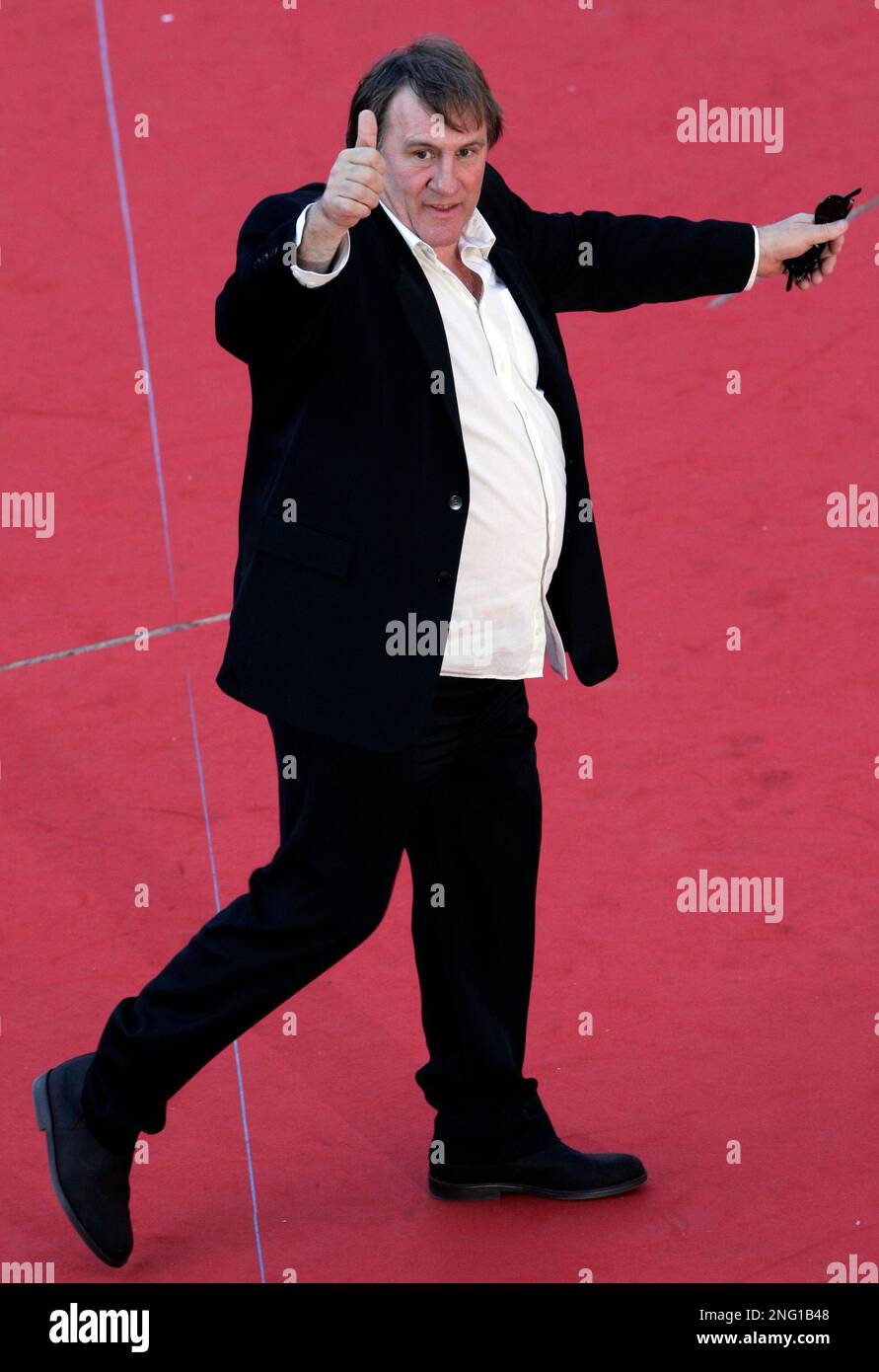 French actor Gerard Depardieu poses for photographers on the red carpet ...