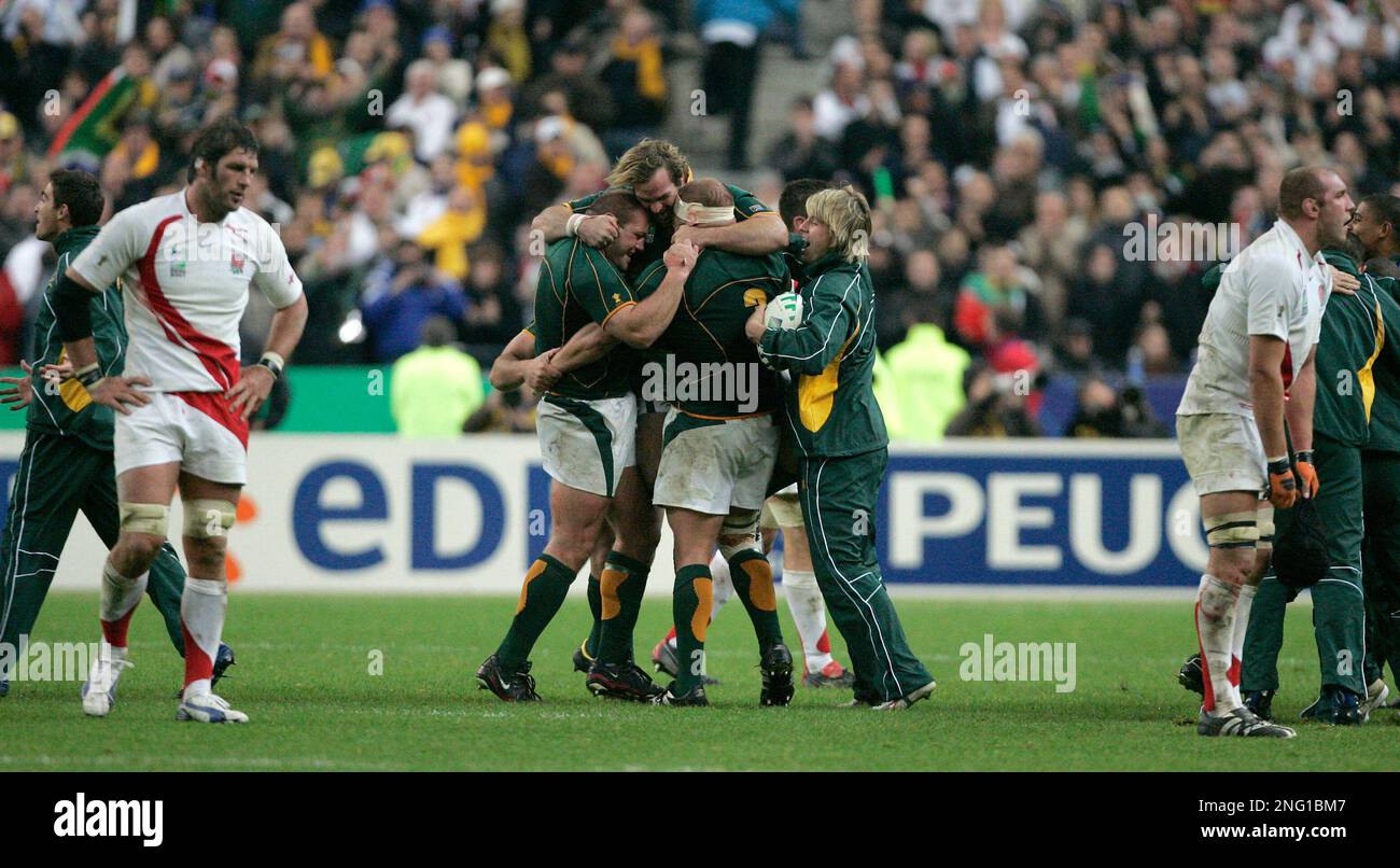 South African players celebrate their victory over England as Simon ...