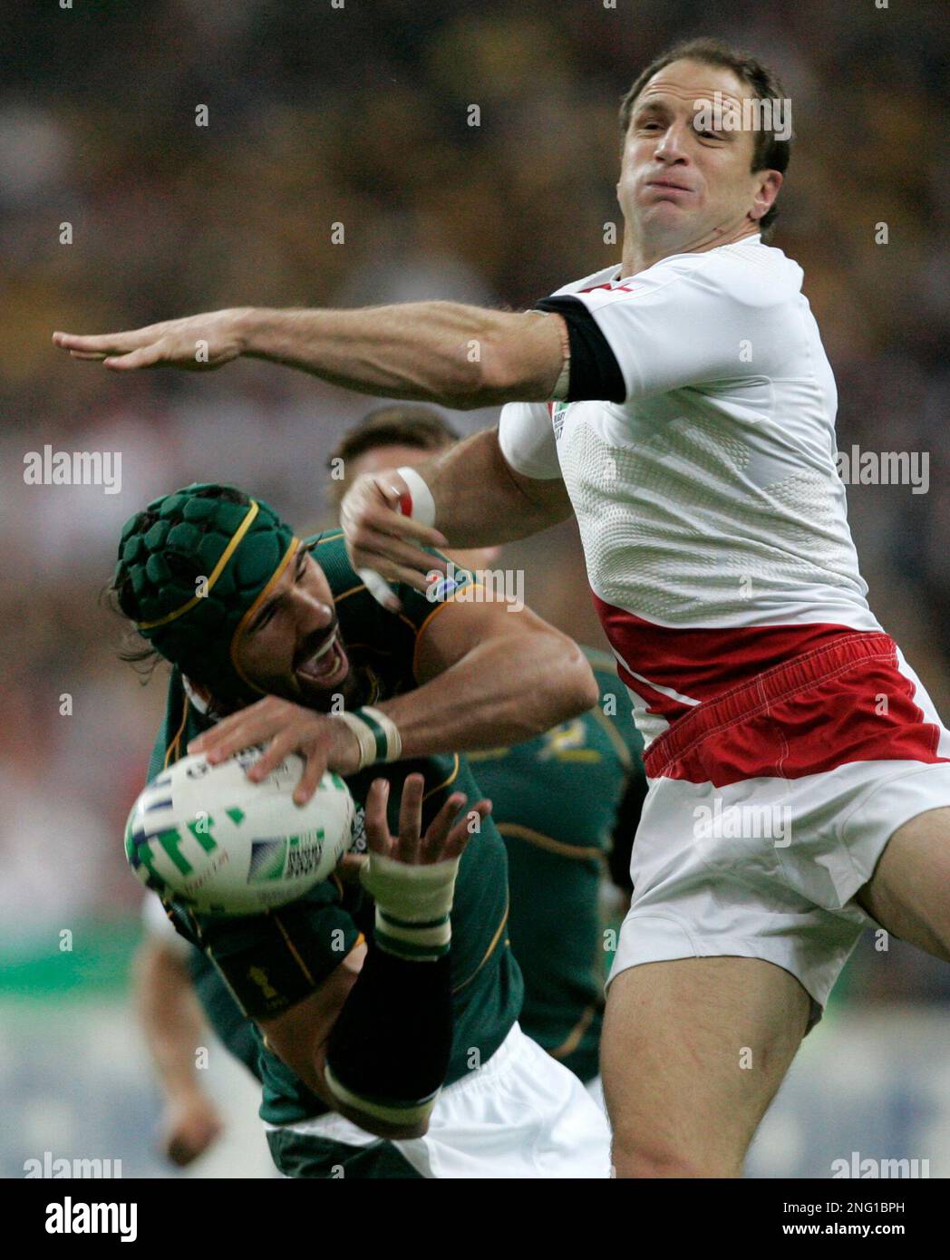 South Africa's Victor Matfield, left, catches the ball despite England ...