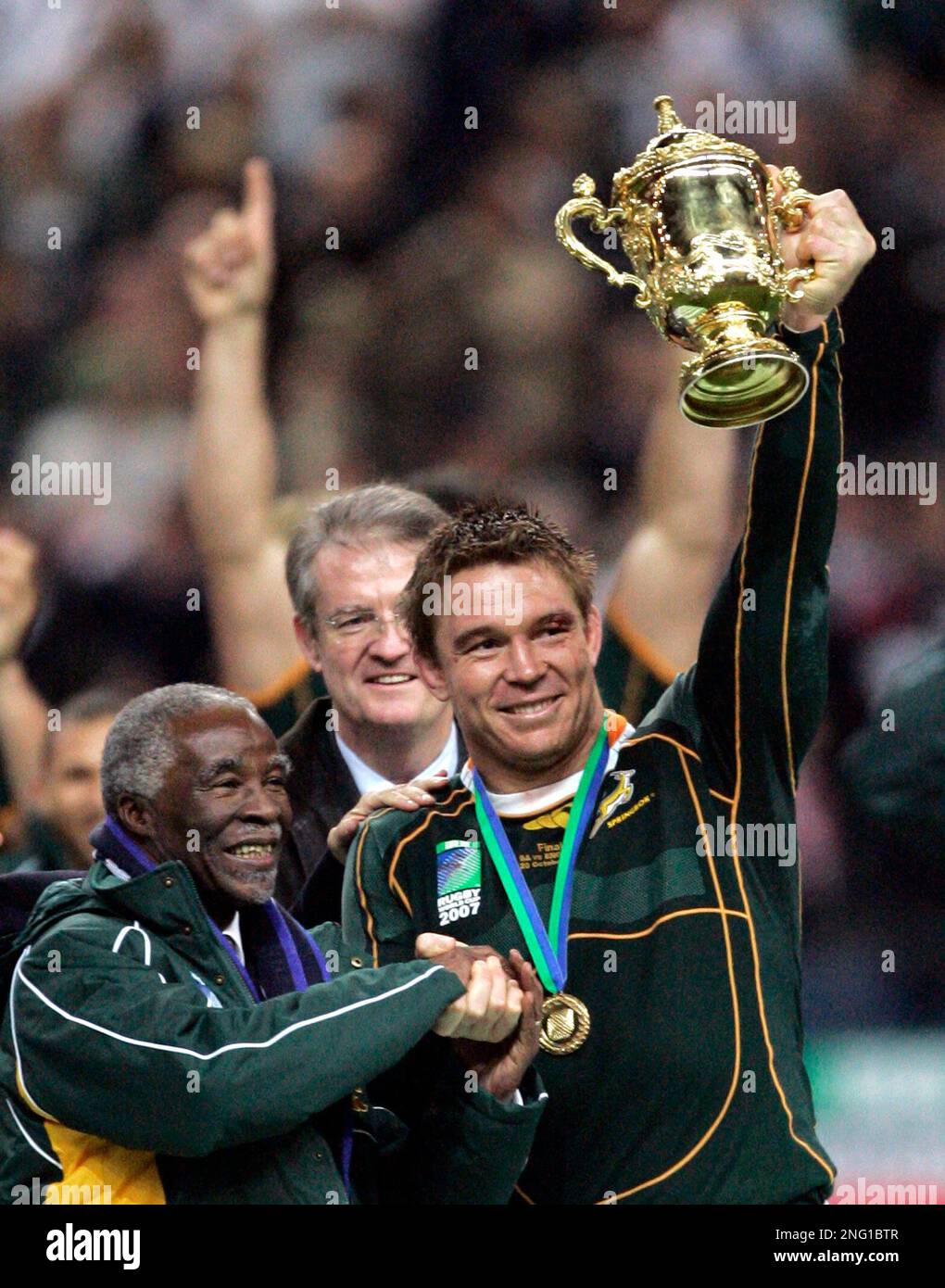 South Africa's President Thabo Mbeki, left, shakes hands with captain ...