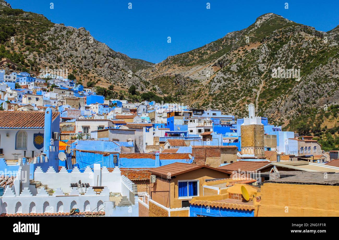 An aerial view of a typical Moroccan city with blue colored houses ...