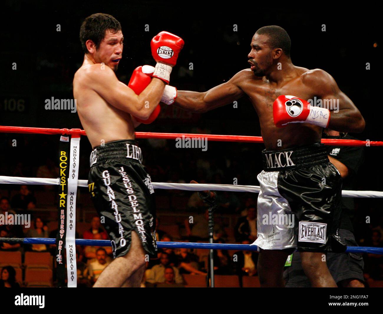 Librado Andrade, left, takes an right by Yusaf Mack, during their super ...