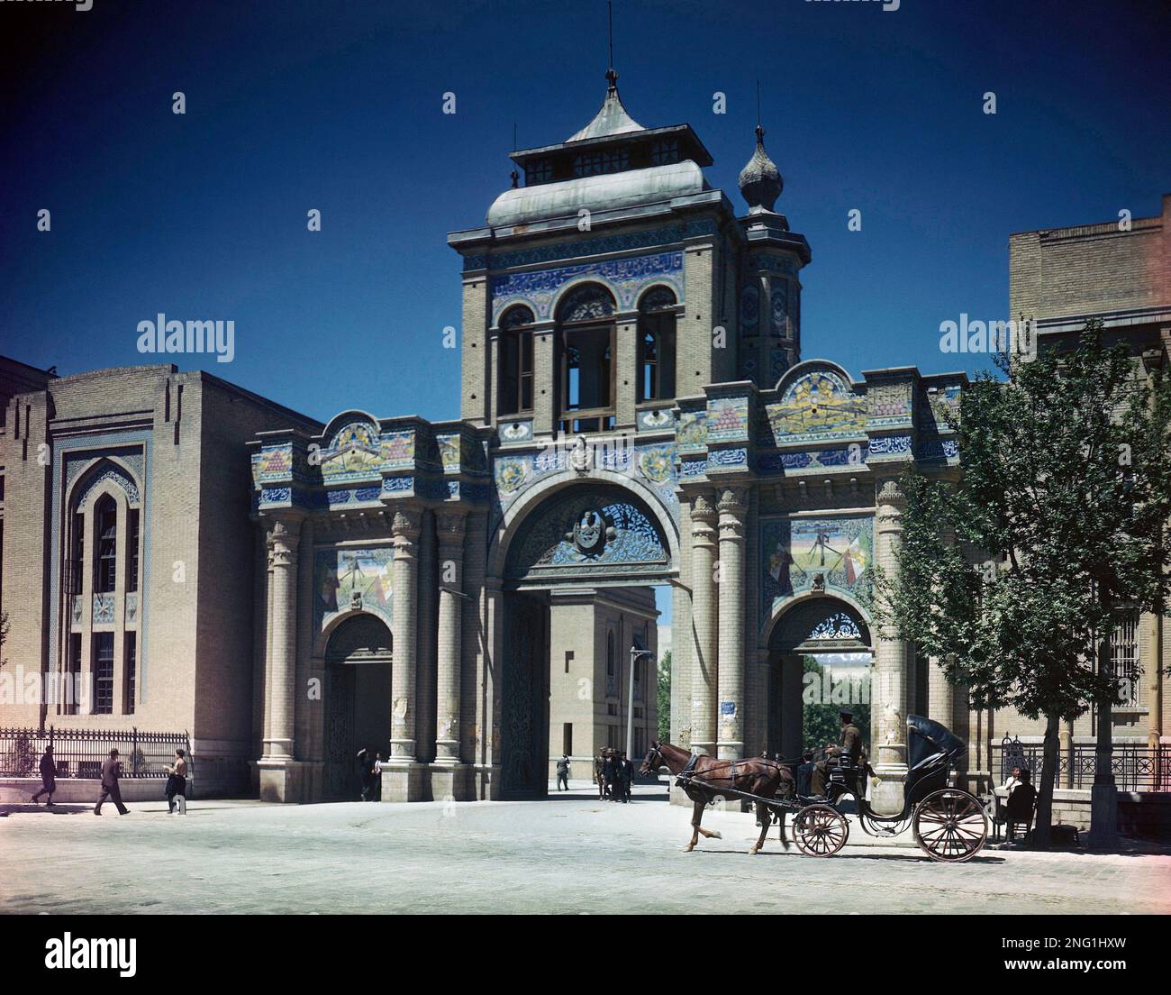 Seen here is a Tehran prayer gate, inscribed with writings from the ...