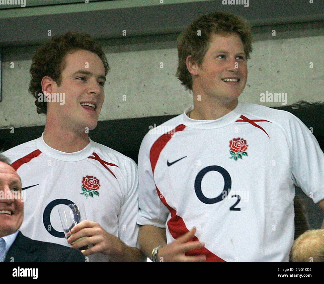 Britain's Prince Harry, right, smiles after England won the Rugby World ...