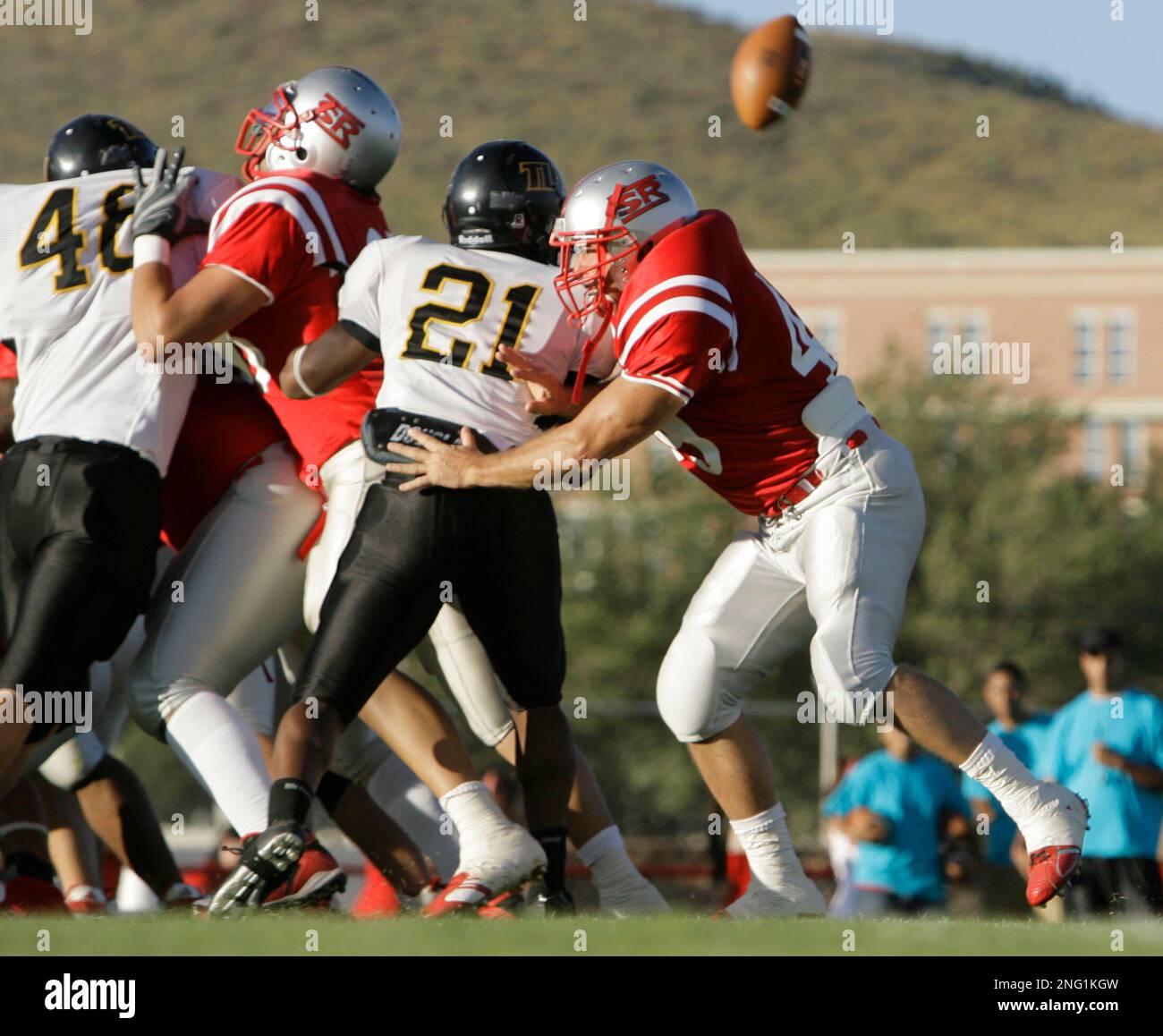 Sul Ross State linebacker Mike Flynt, right, blocks Texas Lutheran's ...