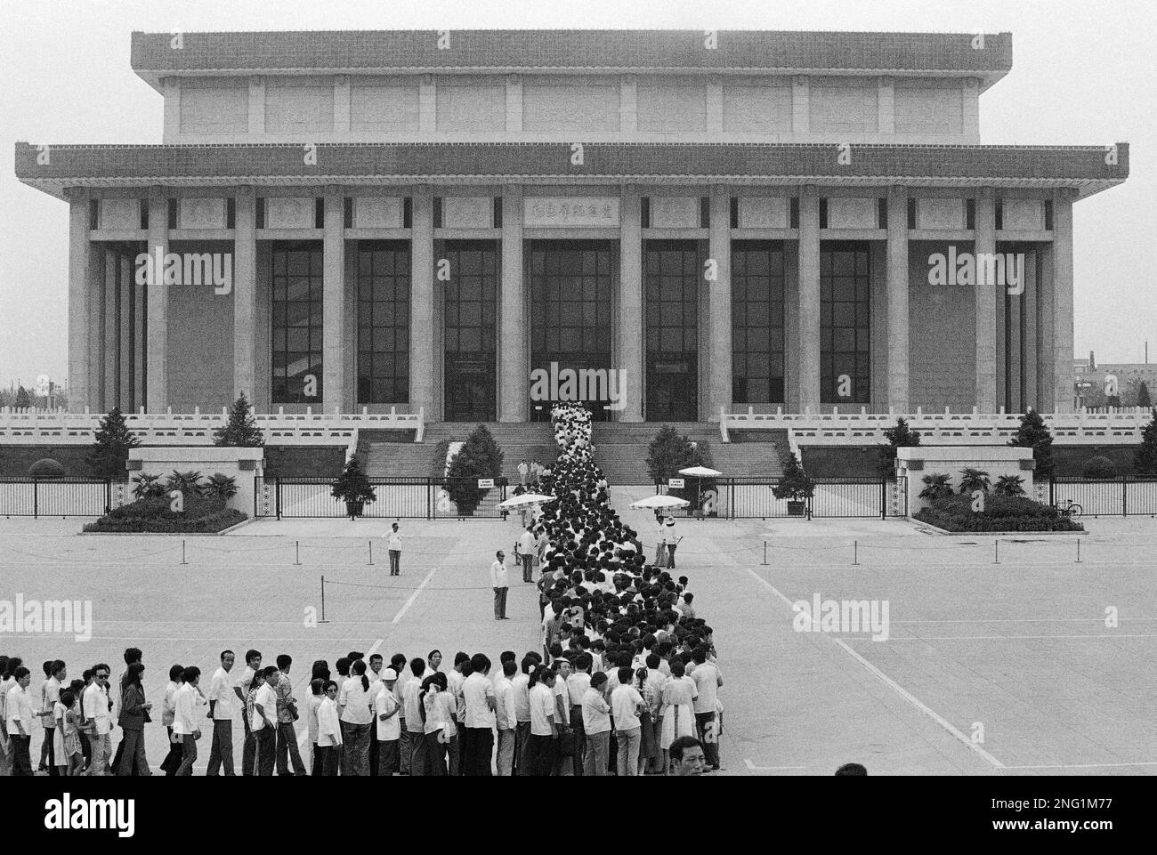 Chinese line up for a brief view of the embalmed body of chairman Mao ...