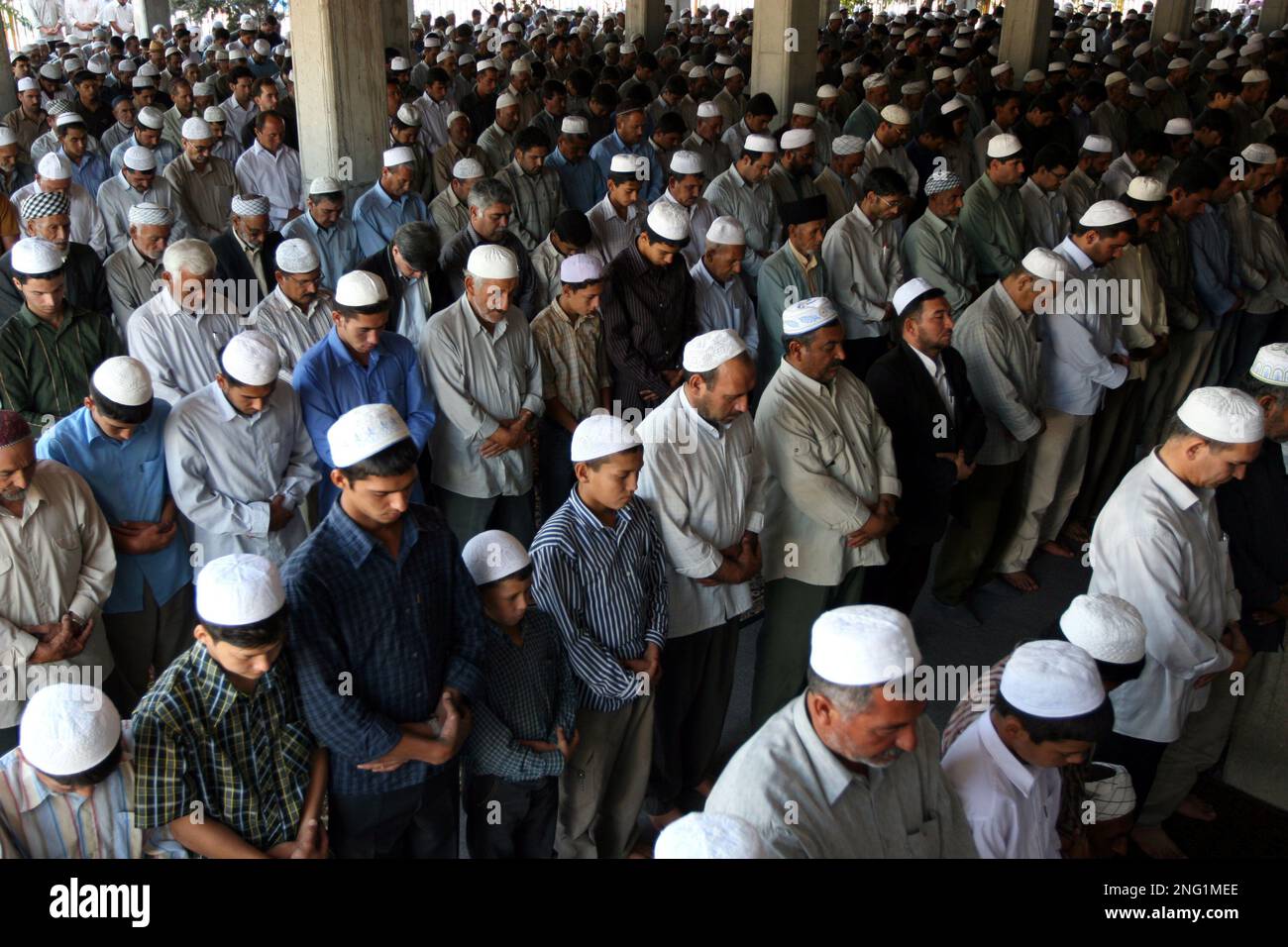 Iranian Sunni men pray during a Friday prayer ceremony in Turkmen, Iran ...