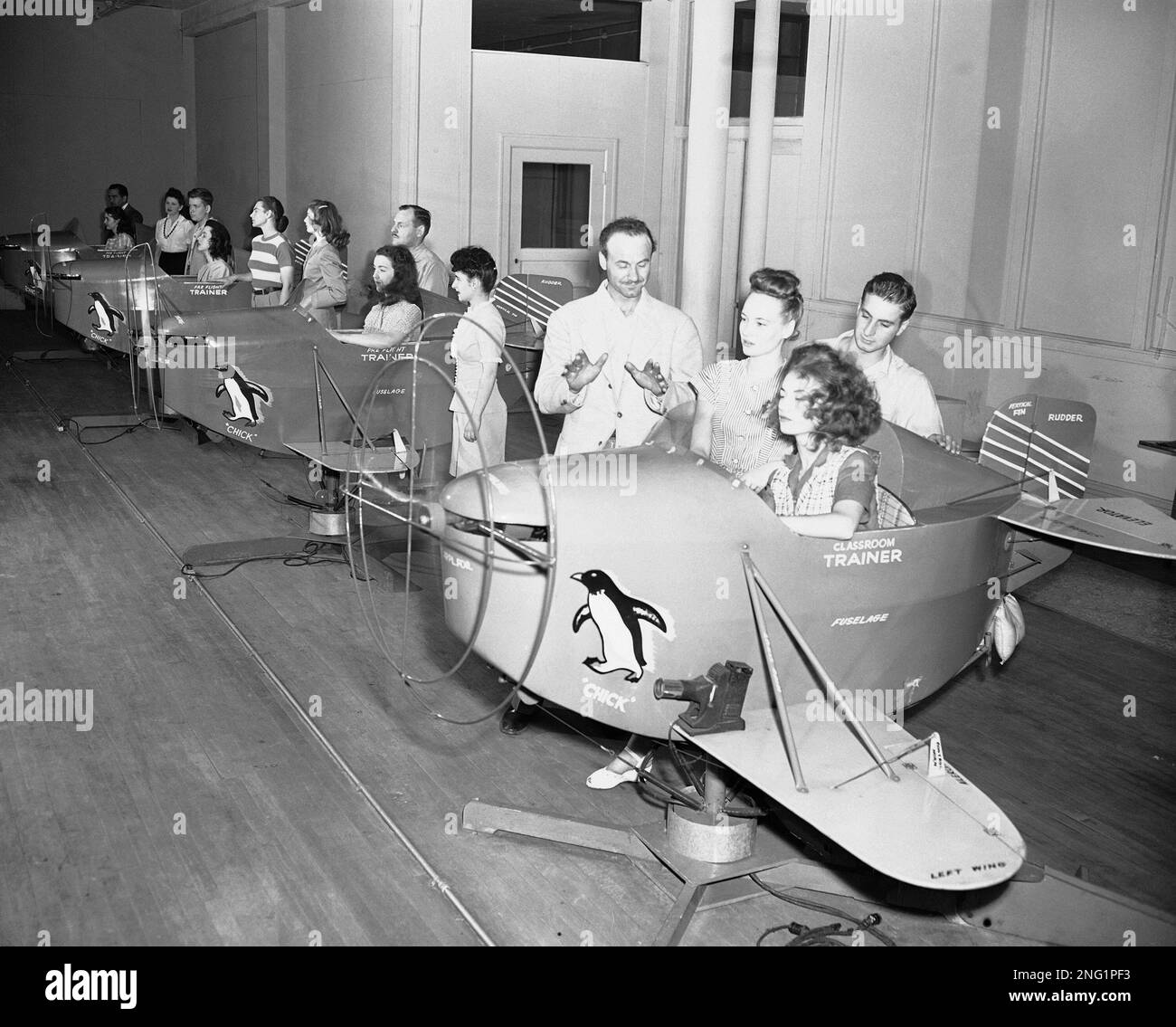 Albert H. Luke, center, instructor at the Sheil School, advises a ...