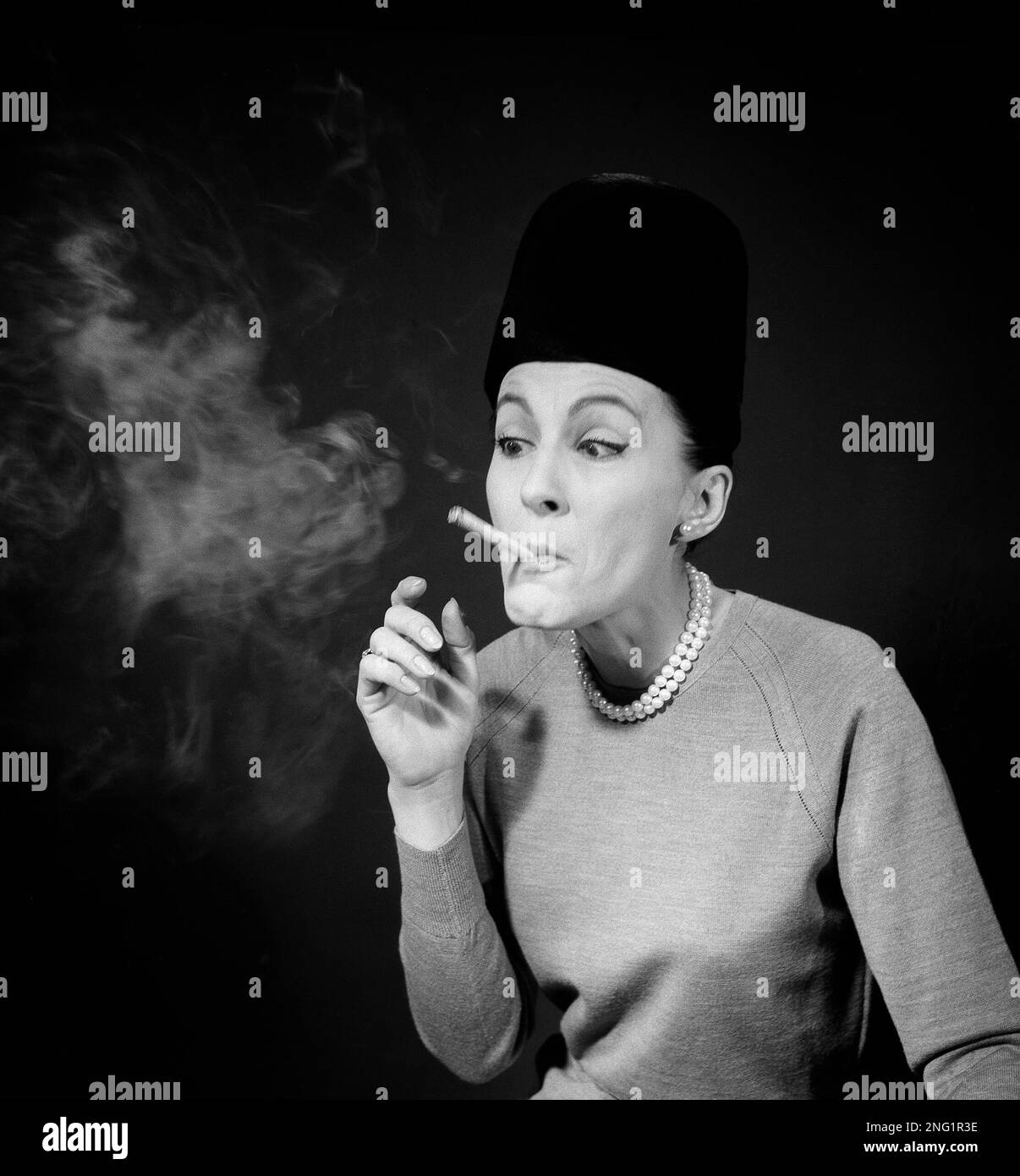 Cathy Bauby demonstrates how one "might" appear while smoking a ...