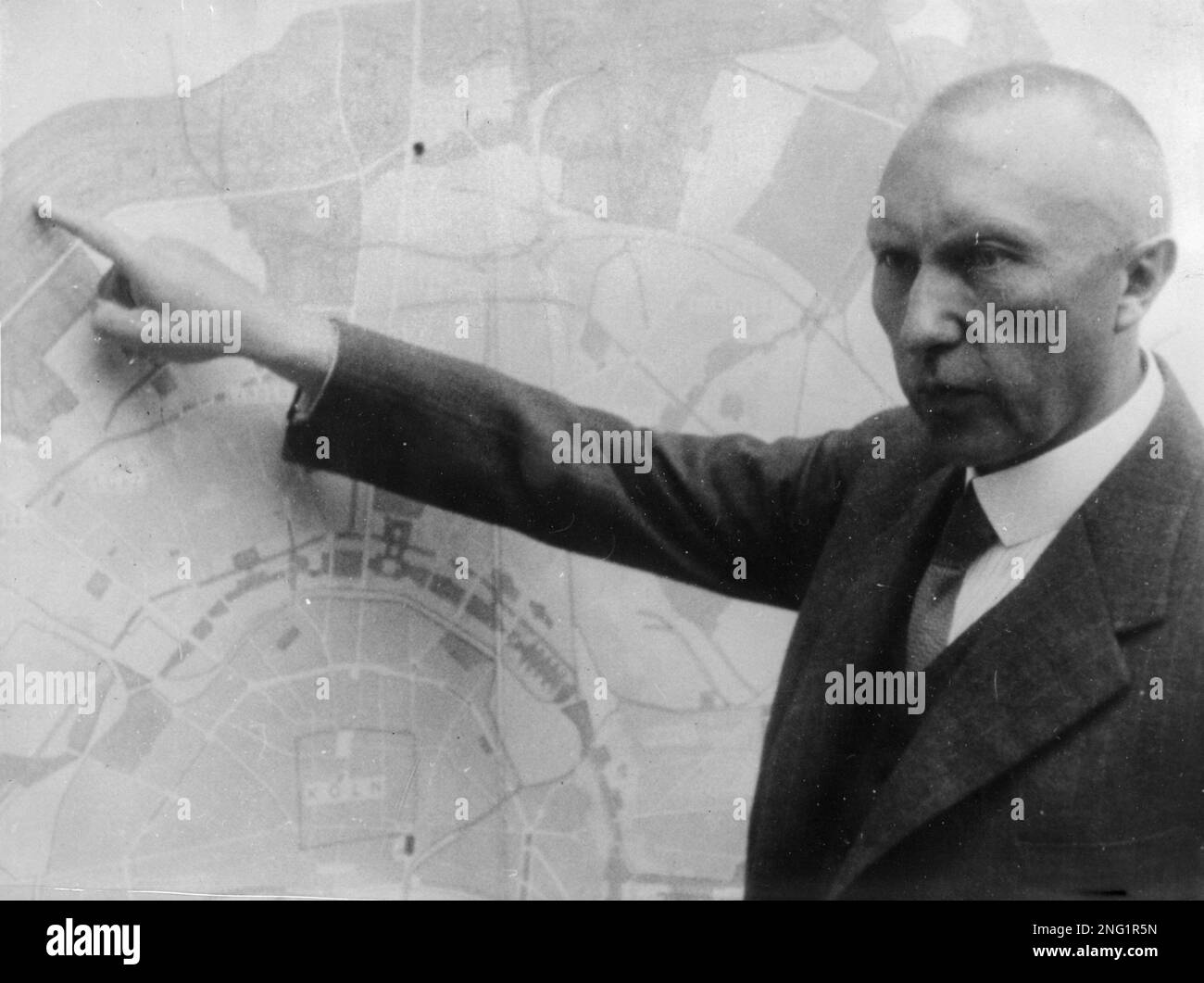 Lord Mayor of Cologne, Germany, Konrad Adenauer, points at a map of the ...